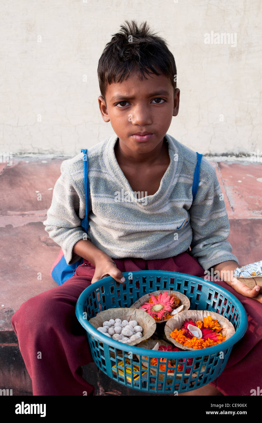 Child selling flowers hi-res stock photography and images - Alamy