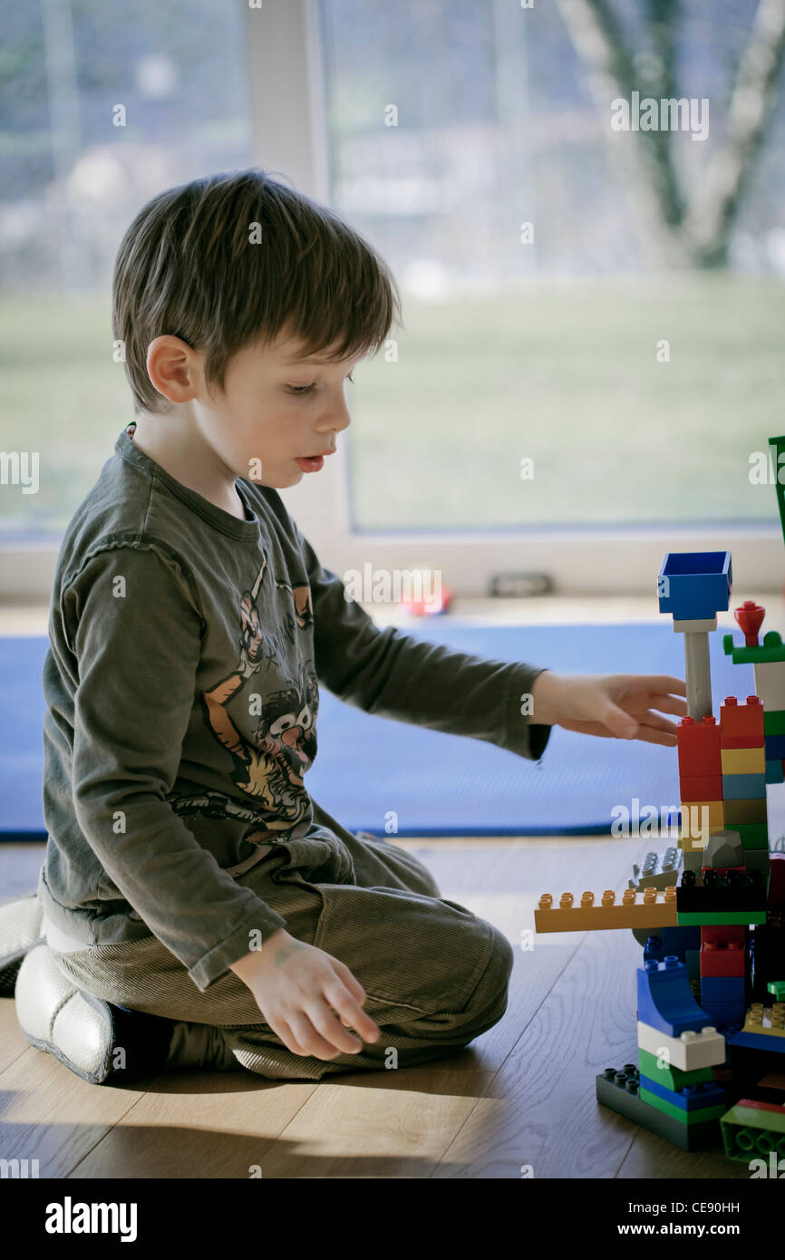 Boy playing indoor Stock Photo - Alamy