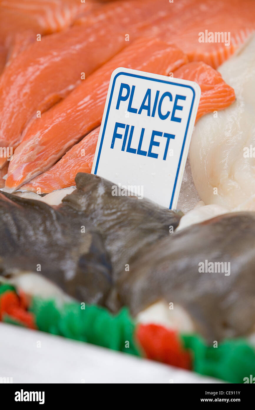 Fresh fish on display on stall in a local indoor market in England ...