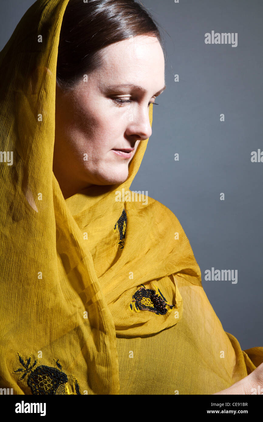 Woman wearing Yellow Shawl Stock Photo - Alamy