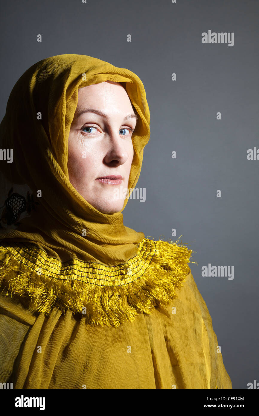 Woman wearing Yellow Shawl Stock Photo - Alamy