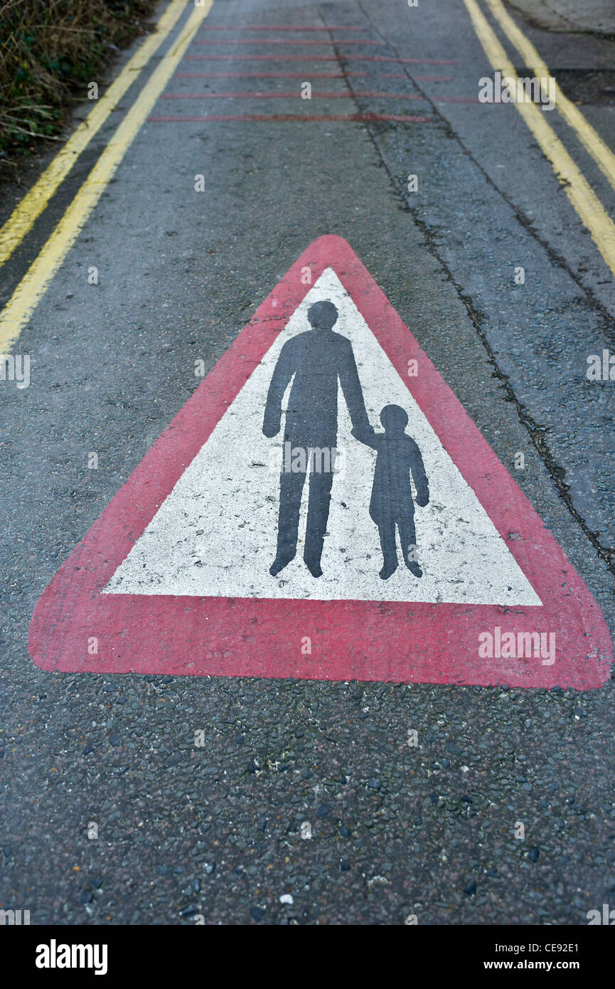 A road sign painted on a road Stock Photo - Alamy