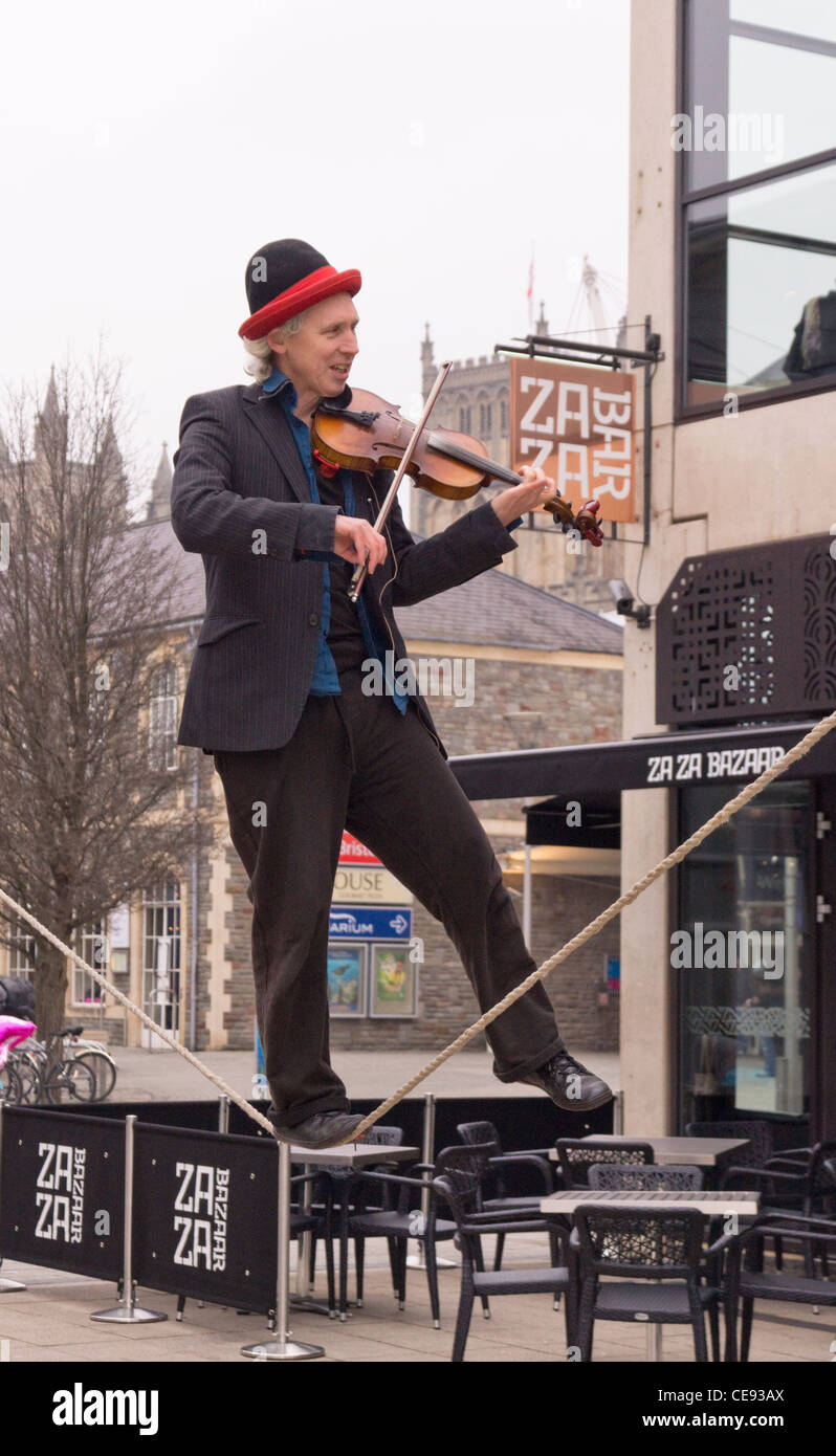 Violin playing slack wire Busker in Bristol Stock Photo - Alamy