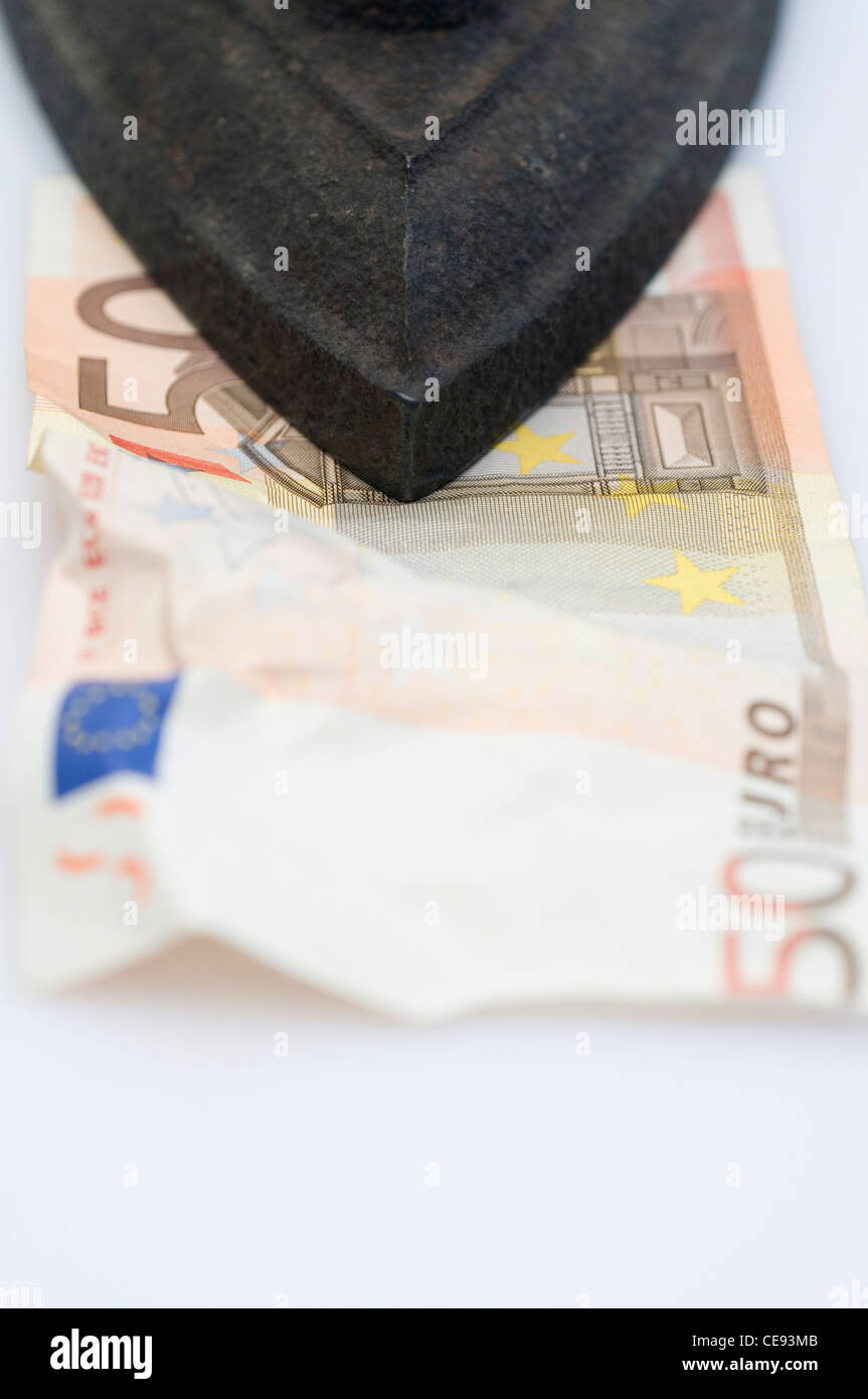 Crumpled 50 euro note being ironed Stock Photo - Alamy