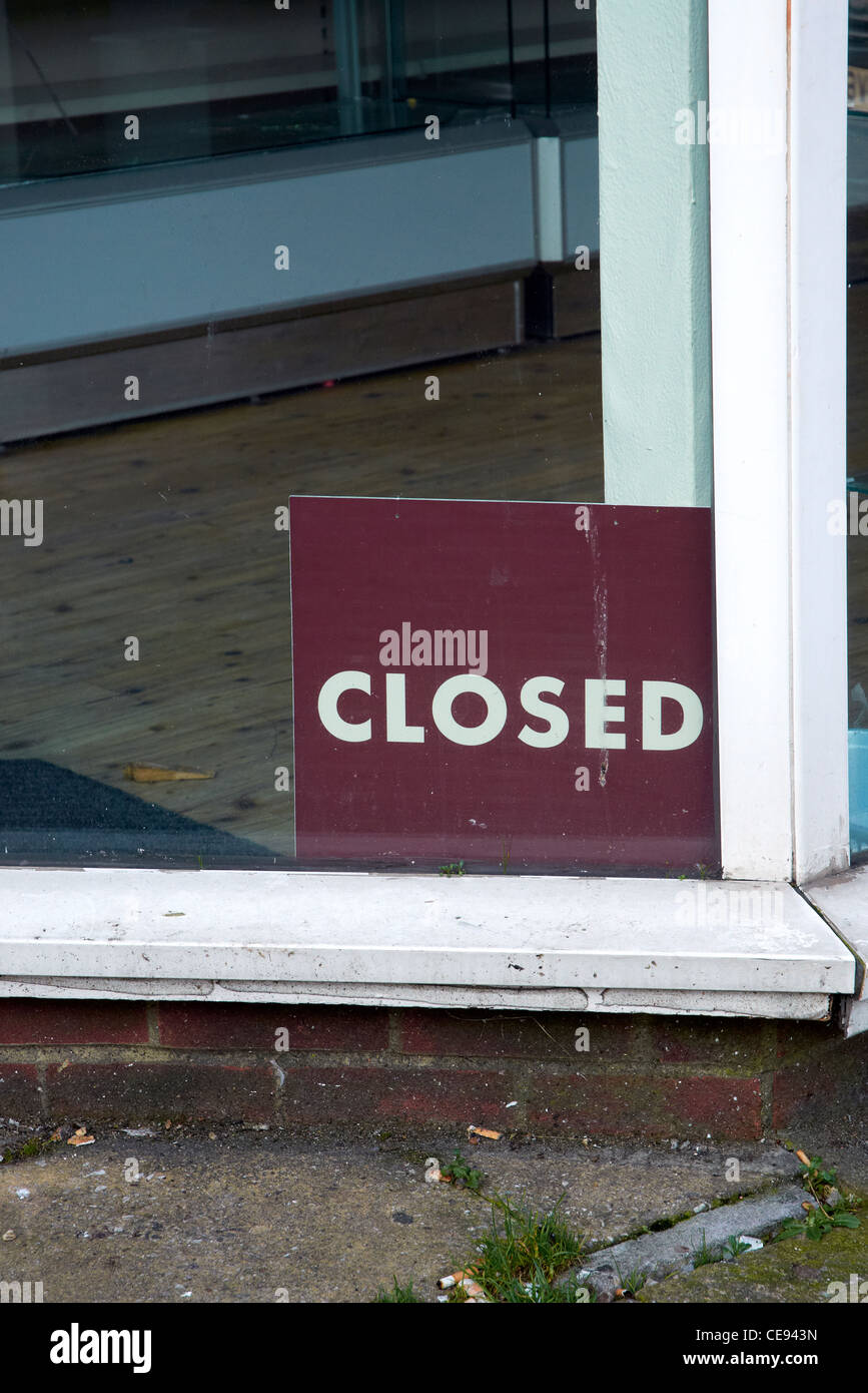 Closed sign in an abandoned shop Stock Photo - Alamy