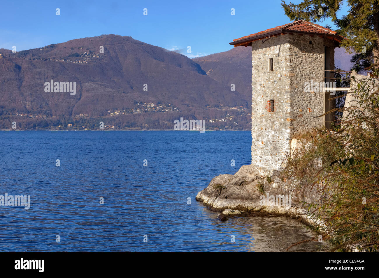 historic Roman watchtower on Lake Maggiore in Calde, Lombardy, Italy ...