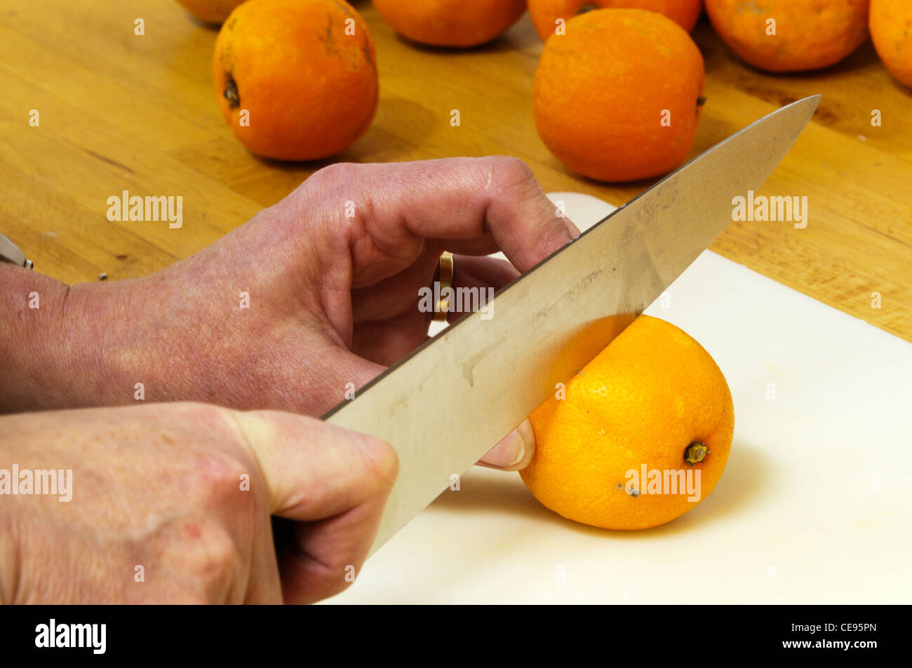 Slicing Oranges to make Marmalade Stock Photo - Alamy