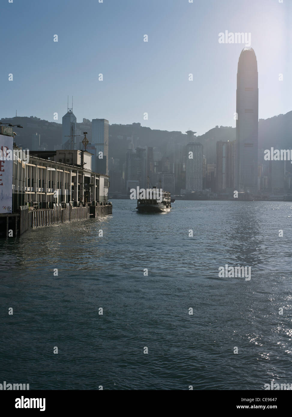 dh TSIM SHA TSUI HONG KONG Star Ferry arriving kowloon pier waterfront Hong Kong harbour skyline ...