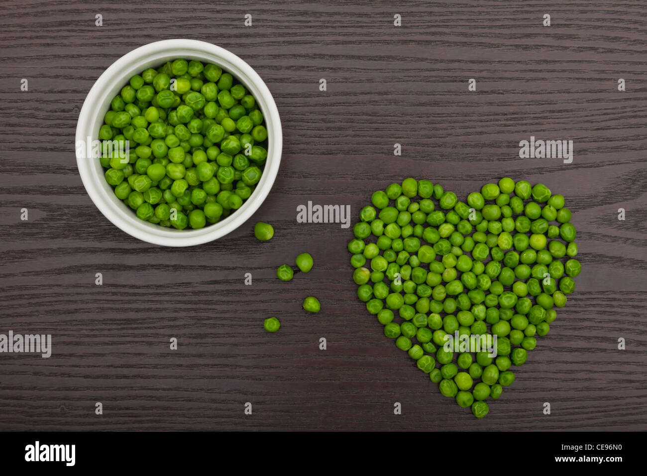 Green peas in heart shape Stock Photo - Alamy