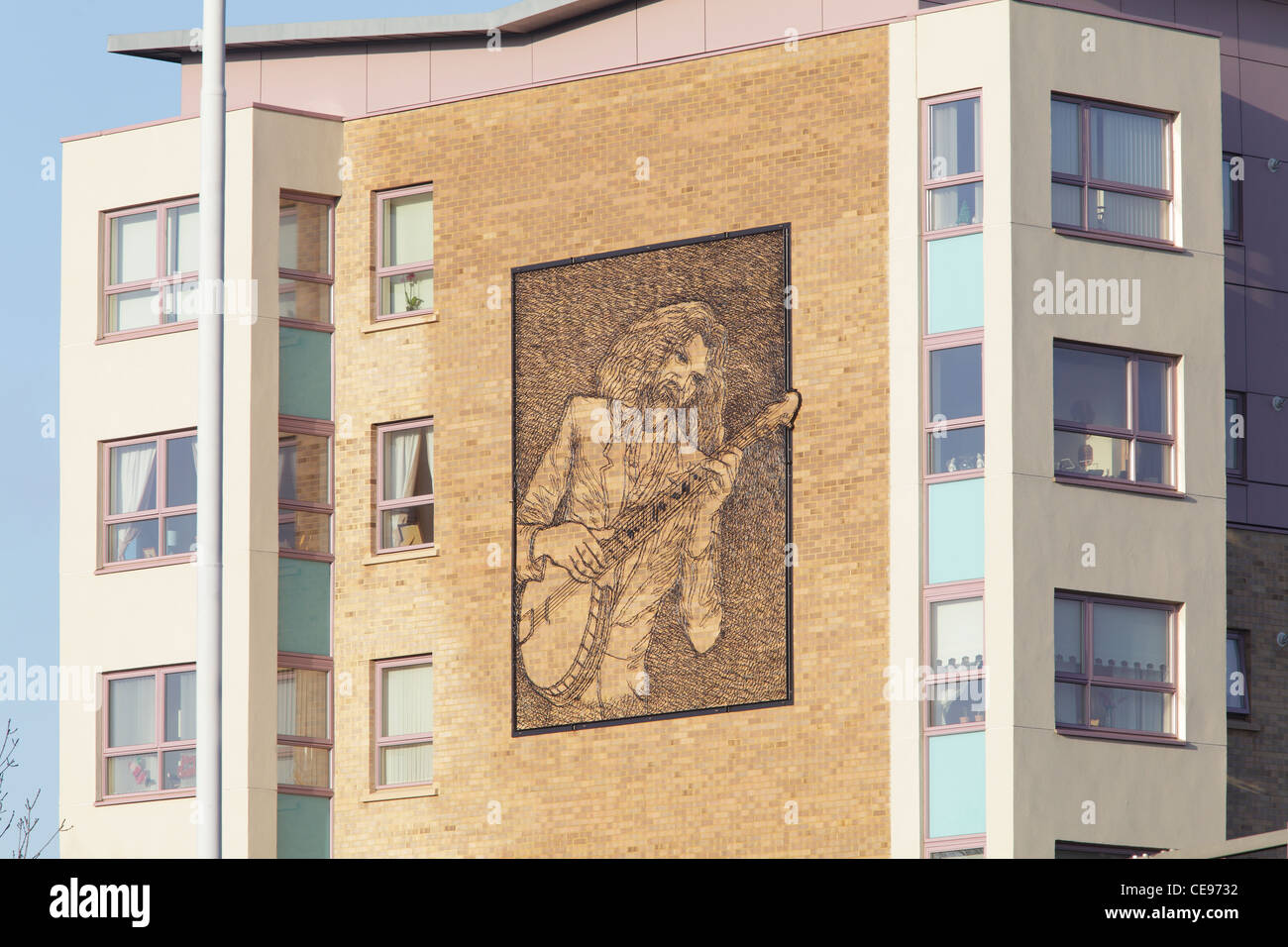 Billy Connolly playing banjo, steel mural of the comedian on a block of ...