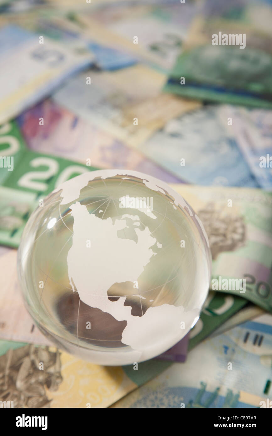 Studio shot of globe on banknotes Stock Photo - Alamy