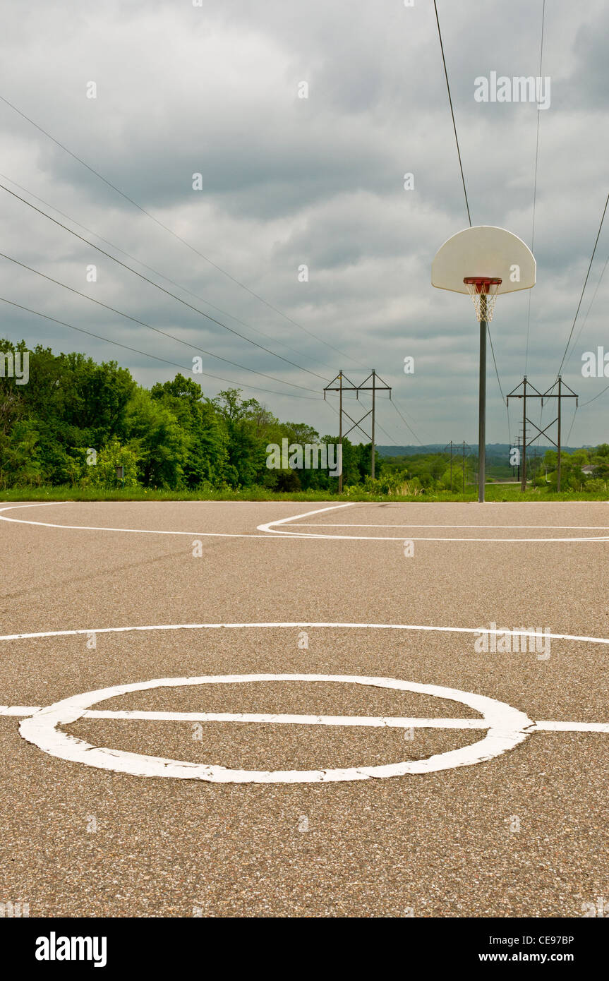 A Low Angle Shot of a Basketball Court with a Cloudy Sky Stock Photo ...