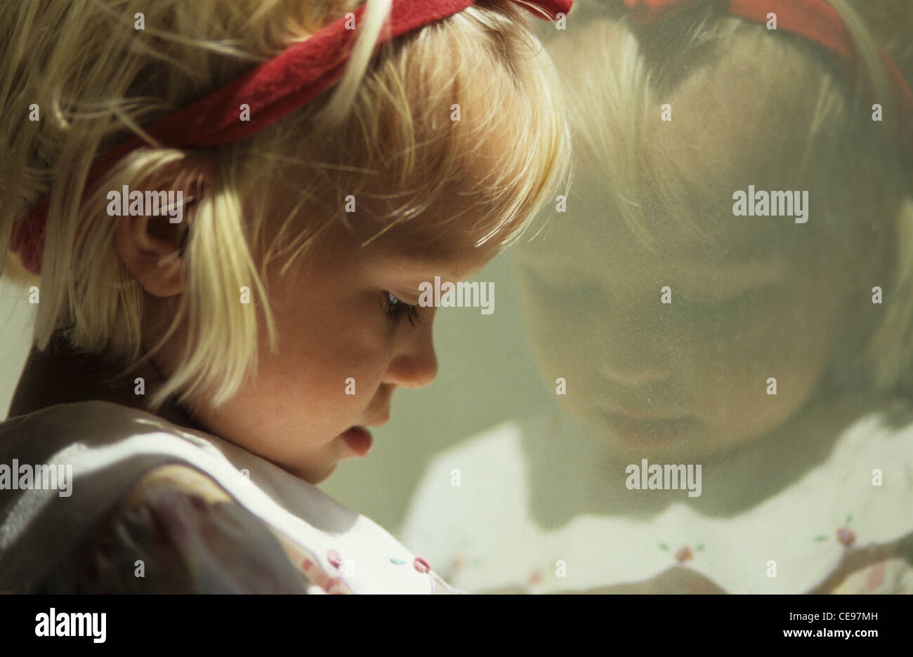 Child with reflection in window Stock Photo - Alamy