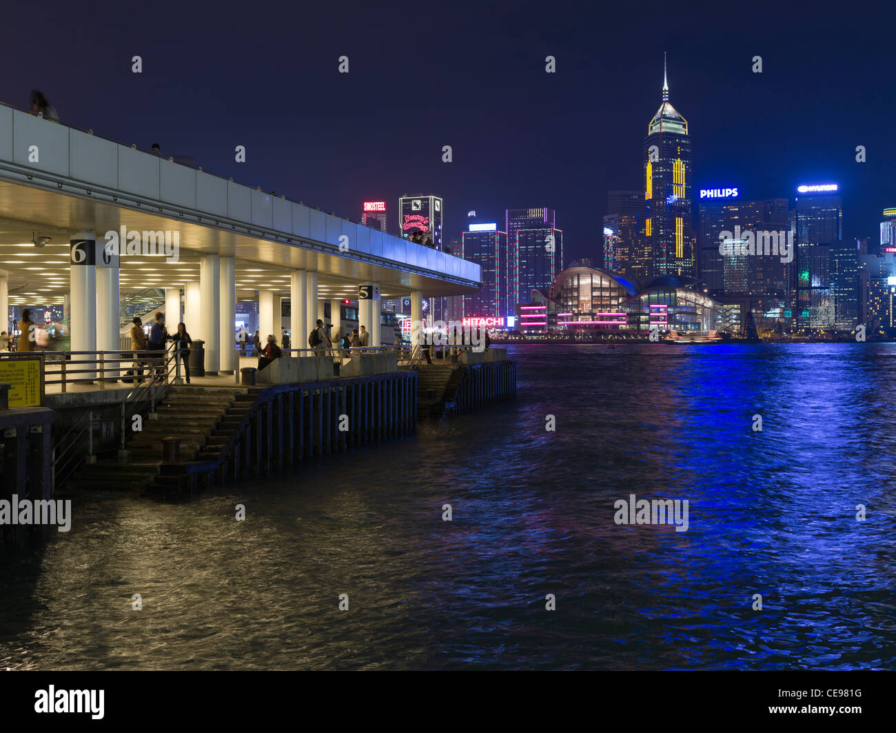 dh Hong Kong harbour TSIM SHA TSUI HONG KONG Kowloon waterfront jetty night lights Stock Photo ...