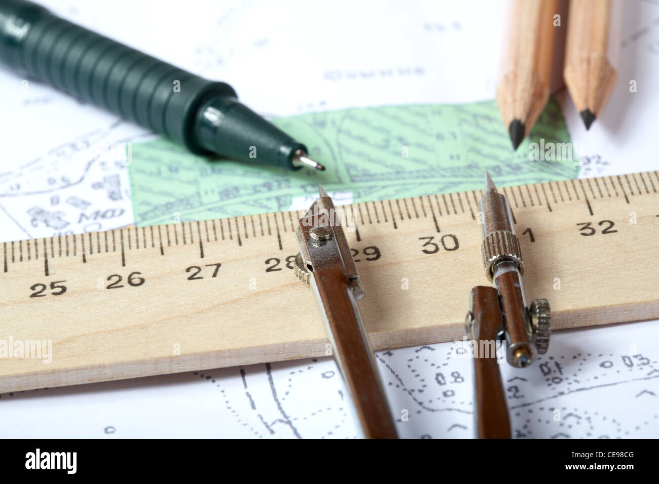 Topographic map of district with measuring instrument, ruler and a ...