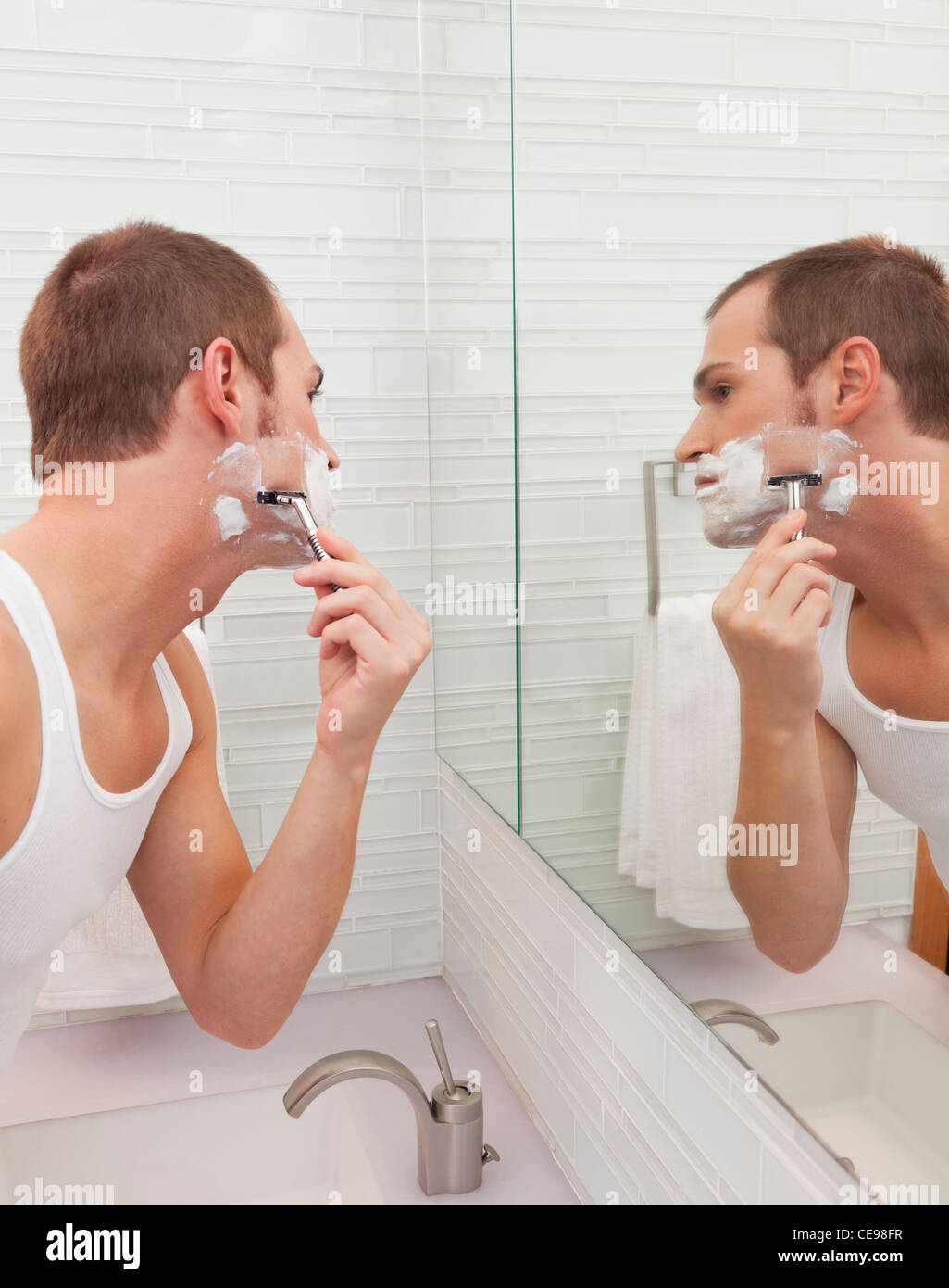 USA, Illinois, Metamora, Man shaving in front of mirror Stock Photo - Alamy