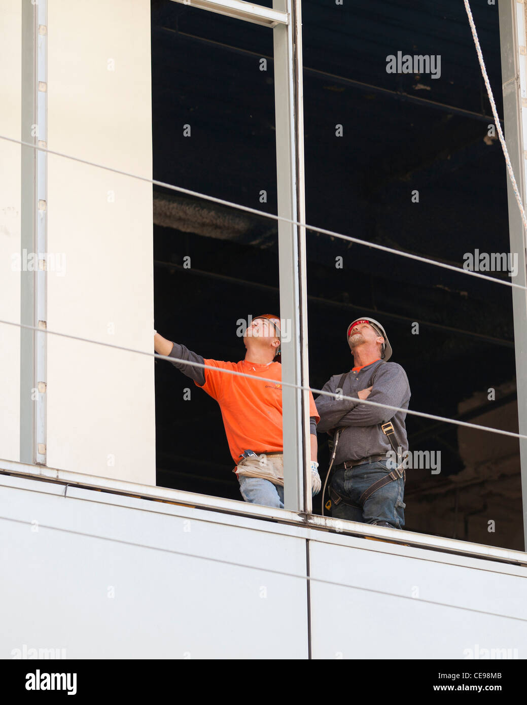 Construction workers working in building Stock Photo - Alamy