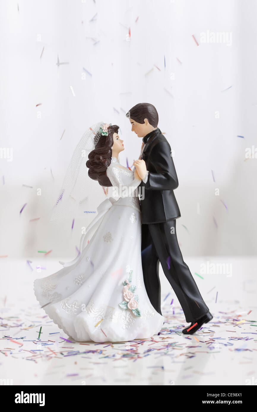 Studio shot of bride and groom figurines dancing Stock Photo - Alamy