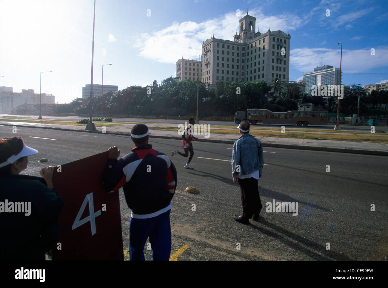 Cubans run in a race along El Malecon Havana, Cuba. The Hotel Nacional ...