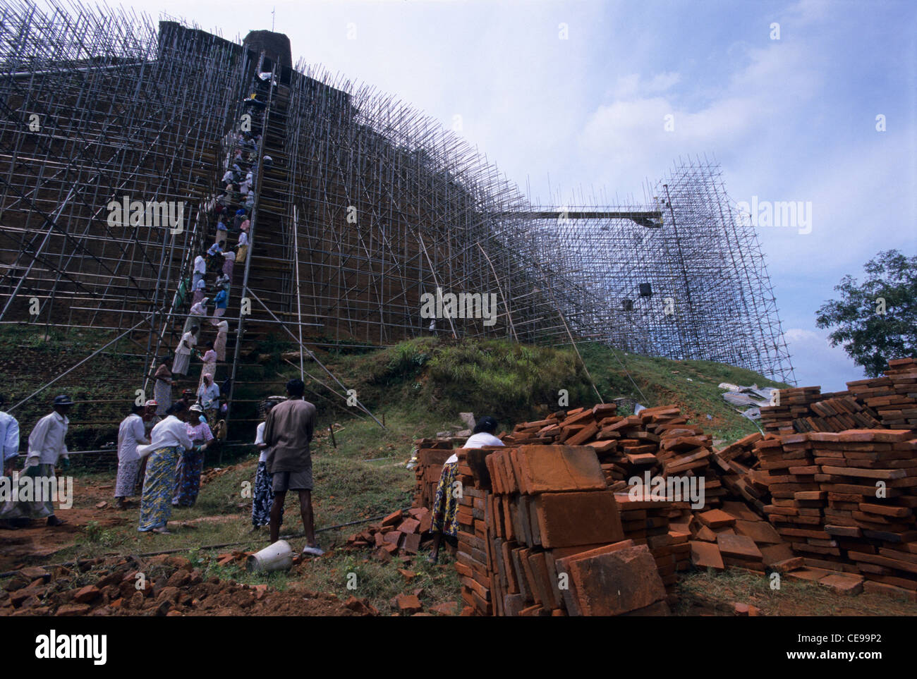 Human chain passing bricks for restoration of stupa Jetavanarama ...