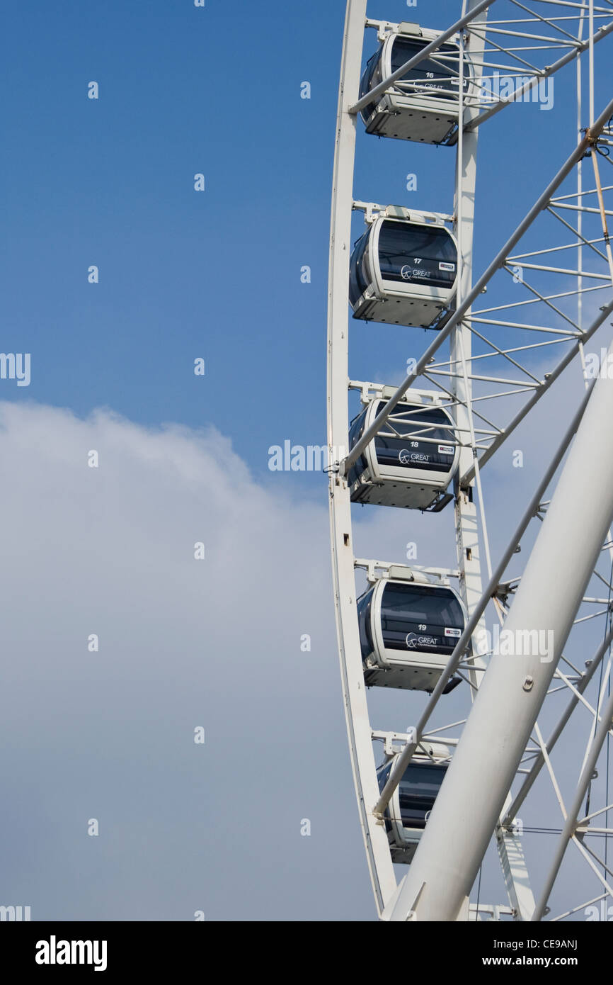 A section of a large ferris wheel with negative space on the left hand ...