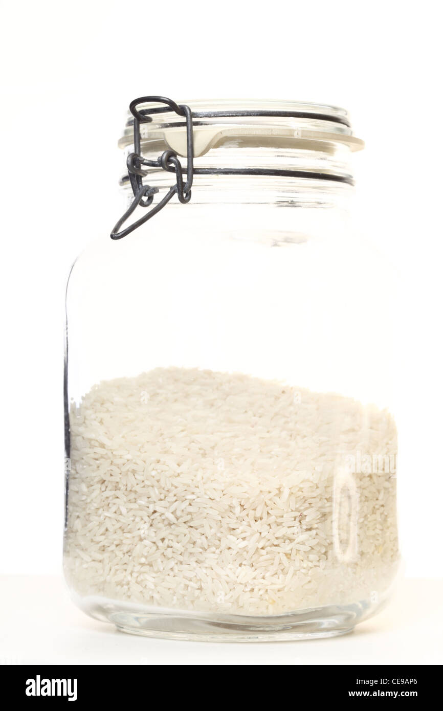 natural rice in jar on white background Stock Photo - Alamy