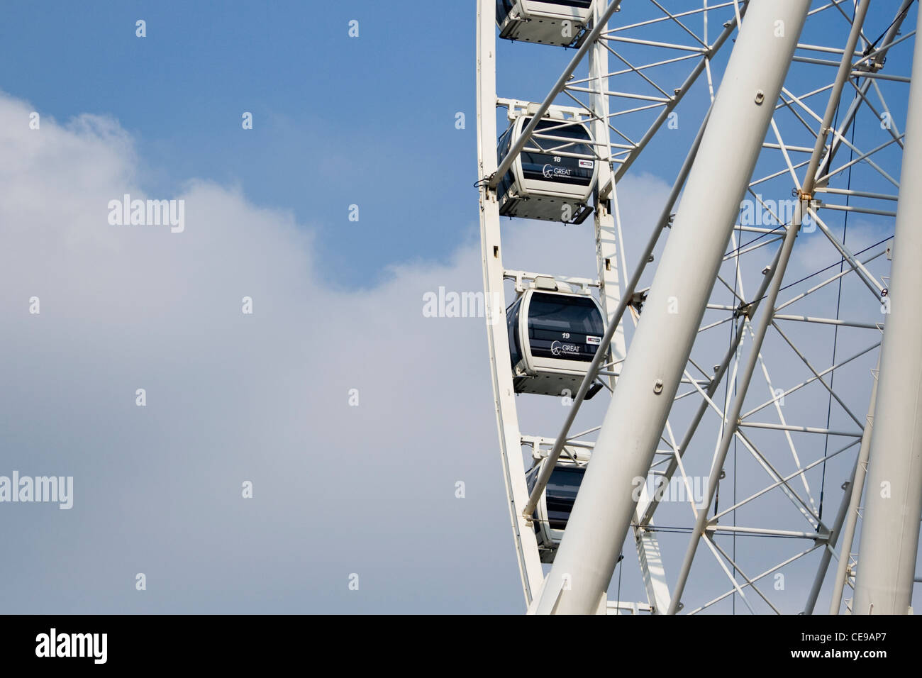 A section of a large ferris wheel with negative space on the left hand ...