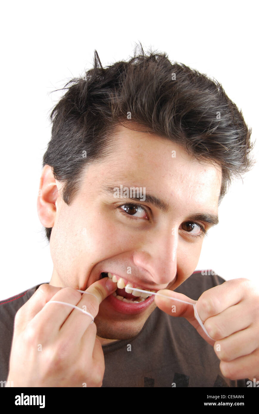 Man flossing his teeth Stock Photo - Alamy