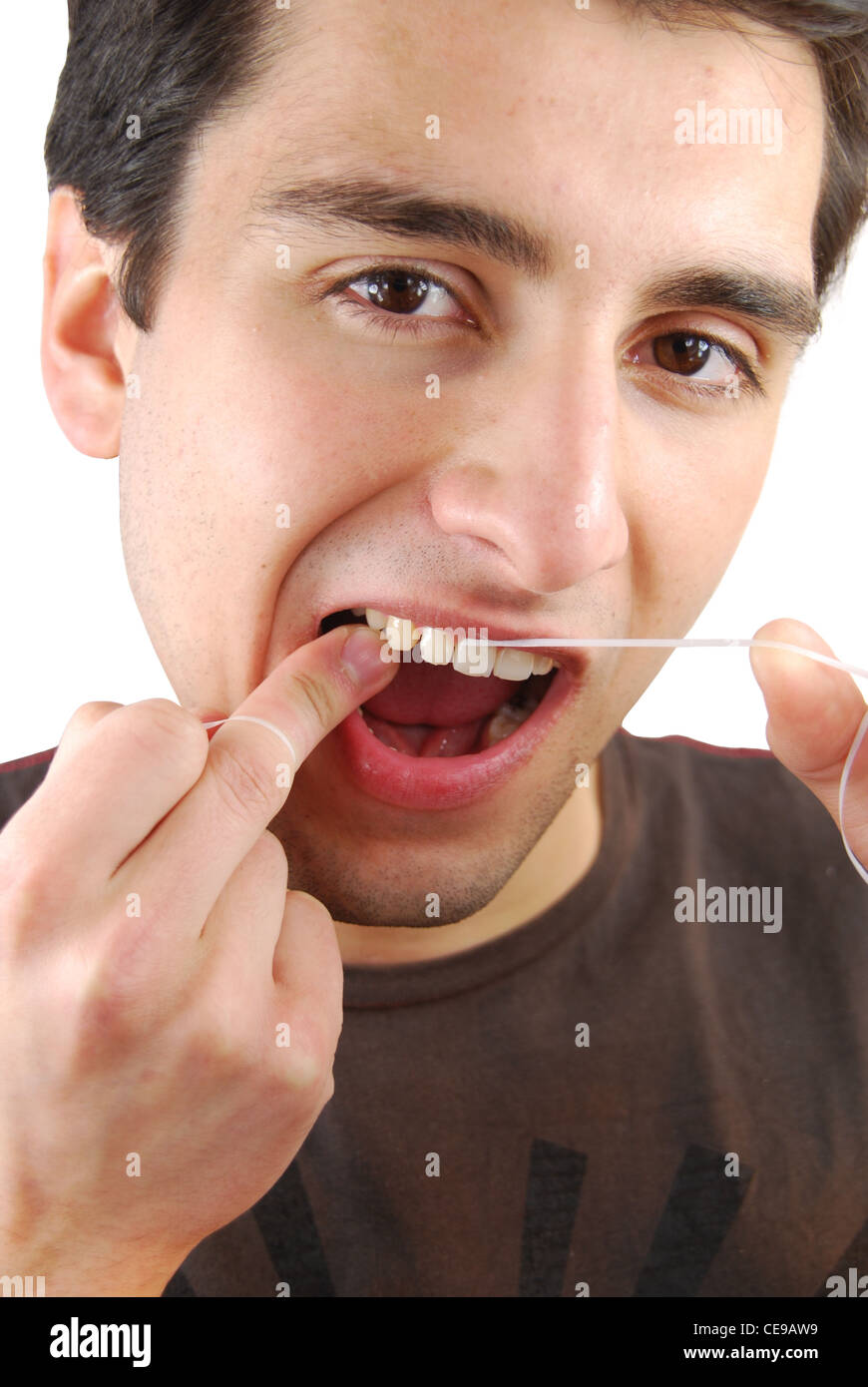 Man flossing his teeth Stock Photo - Alamy