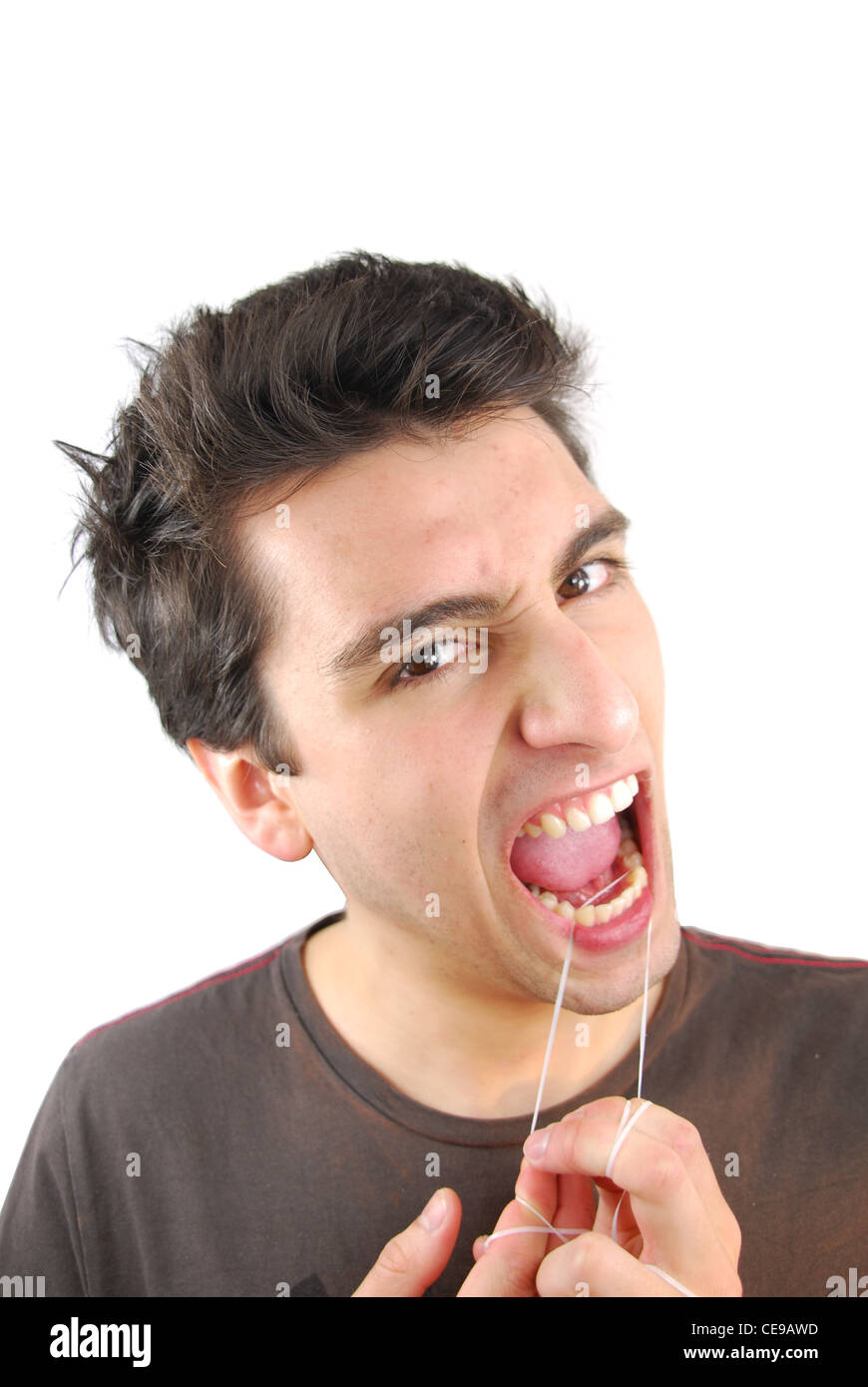 Man flossing his teeth Stock Photo - Alamy
