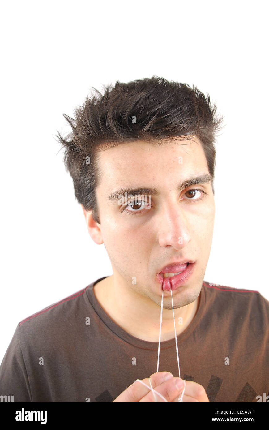 Man flossing his teeth Stock Photo - Alamy