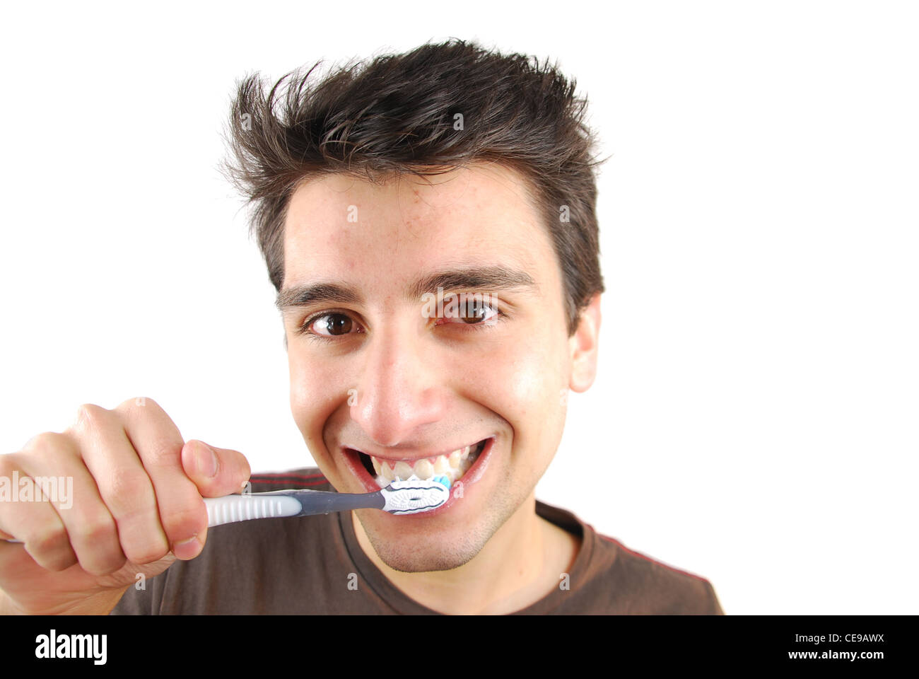 Cute guy washing his teeth Stock Photo - Alamy