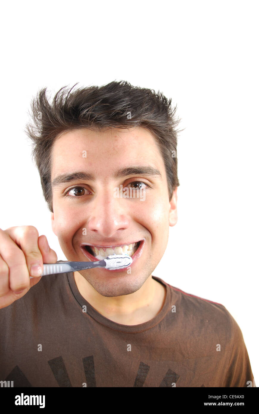 Cute guy washing his teeth Stock Photo - Alamy