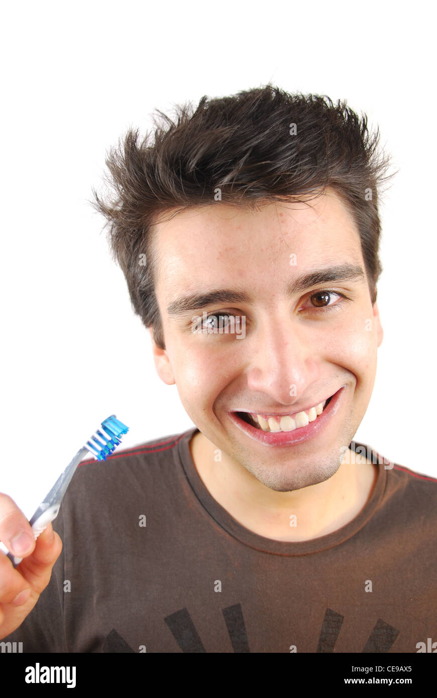 Cute guy washing his teeth Stock Photo - Alamy