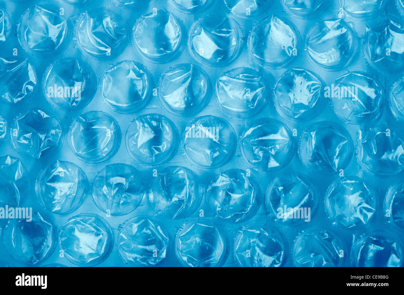 Blue Plastic bubble wrap pattern closeup Stock Photo - Alamy
