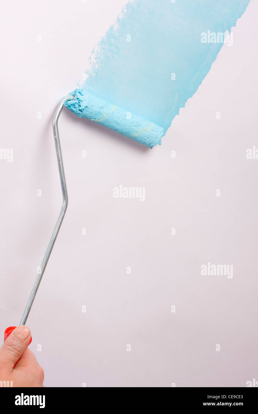 house painter using a paint roller, painting a wall in motion Stock ...