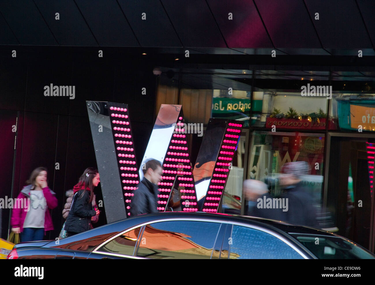 London England neon sign outside building West End Stock Photo - Alamy