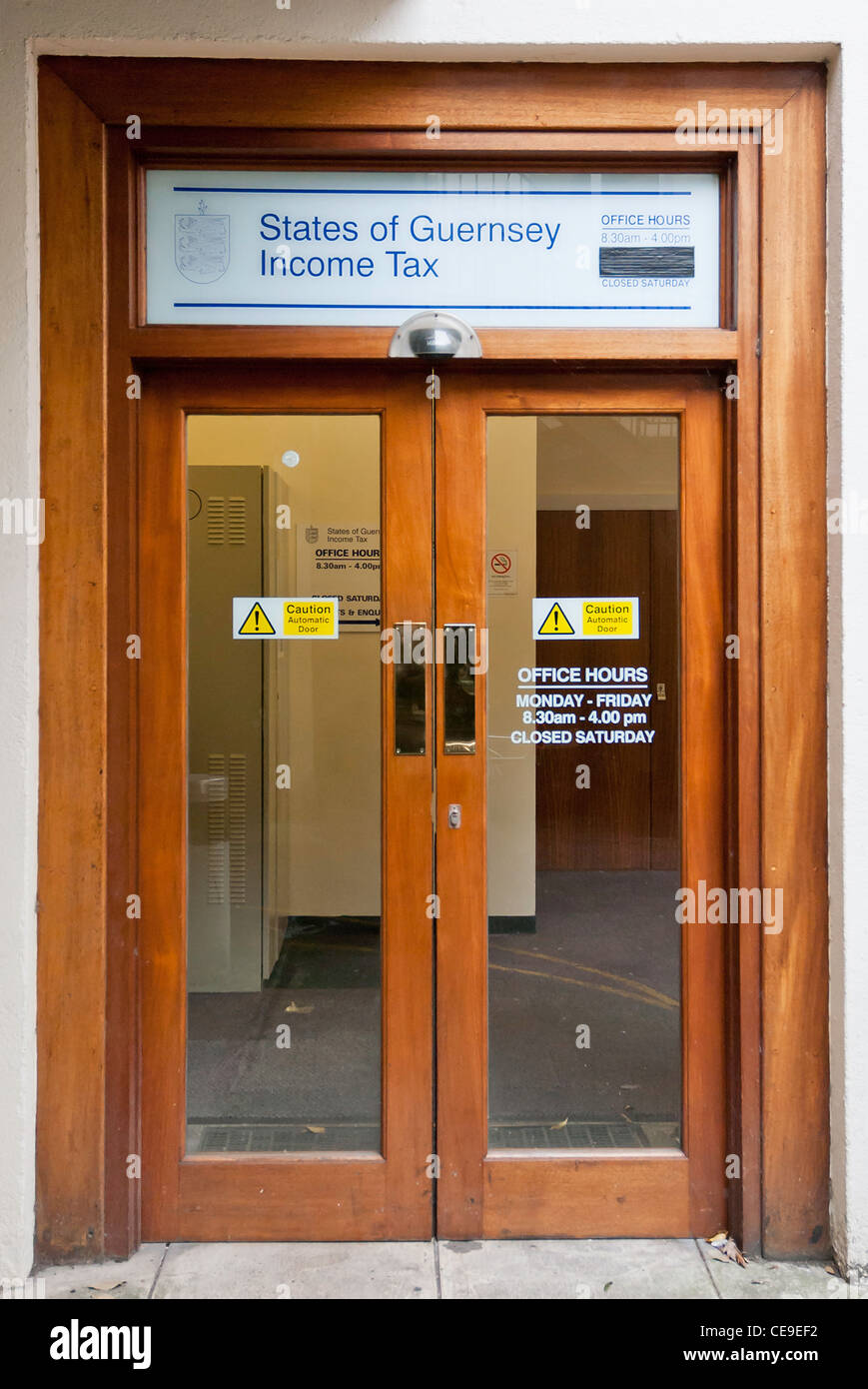 Entrance doorway for the States of Guernsey Income Tax offices Stock ...