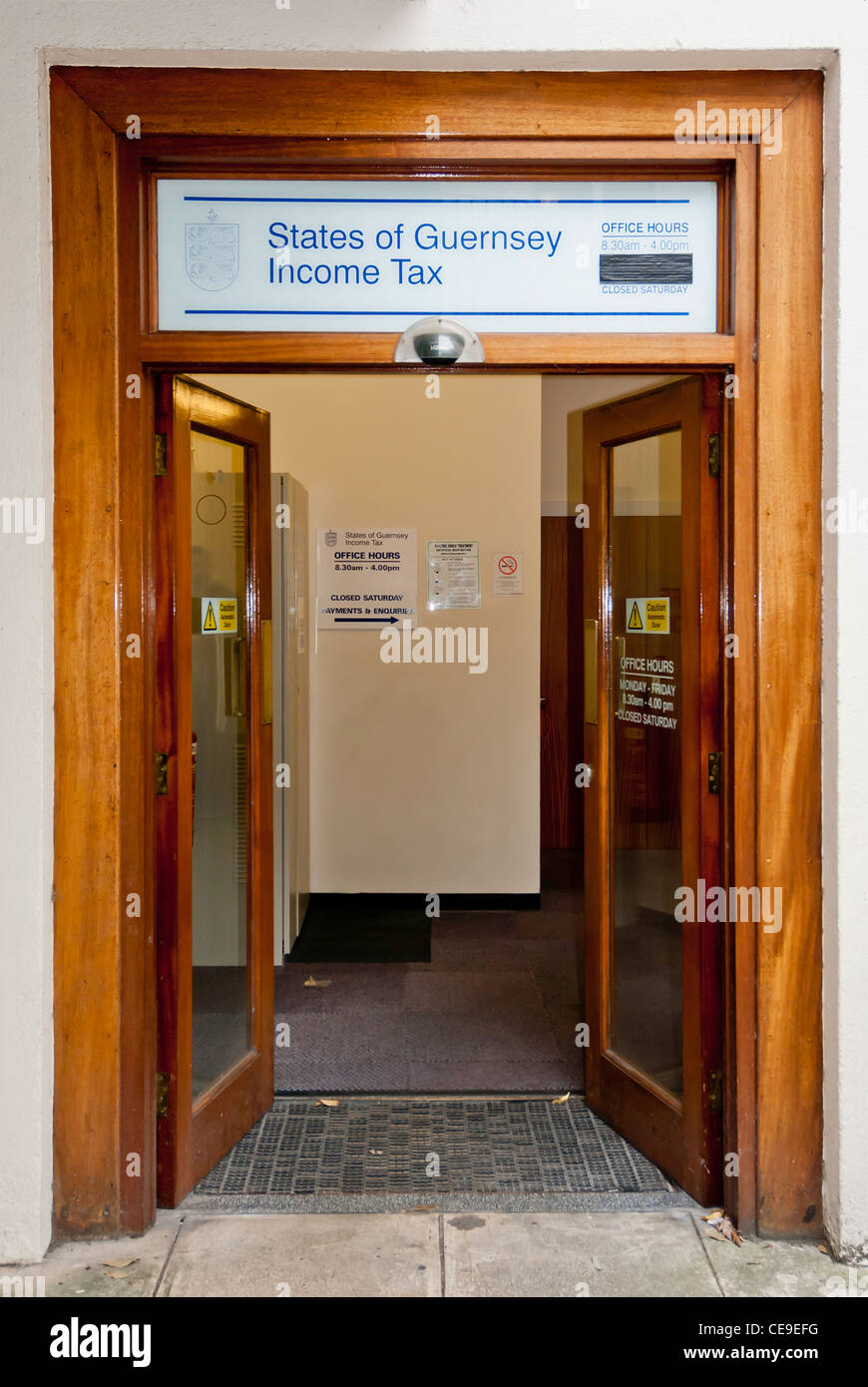 Entrance doorway for the States of Guernsey Income Tax offices Stock ...