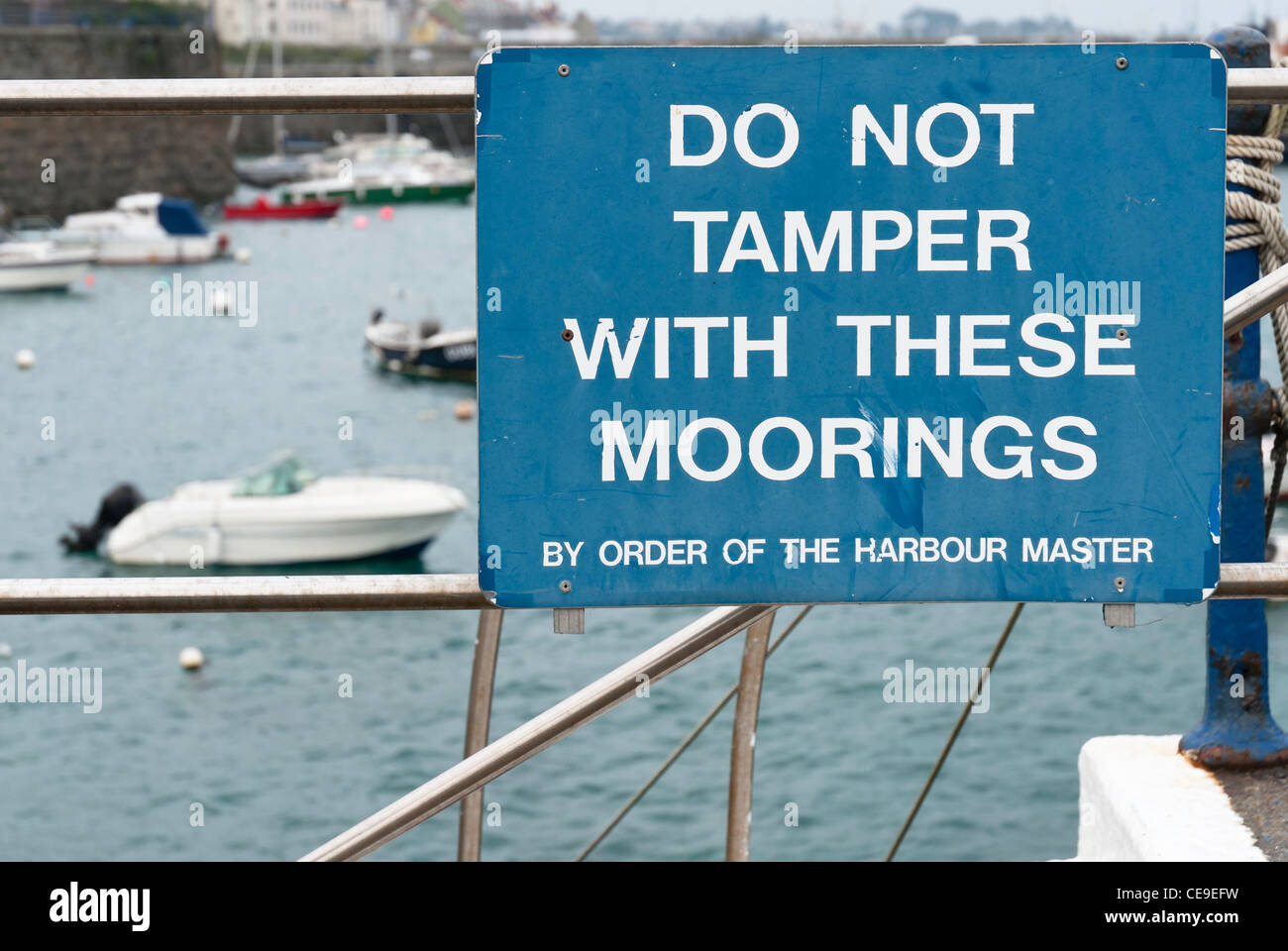 'Do Not Tamper With These Moorings' sign with boats in the background ...