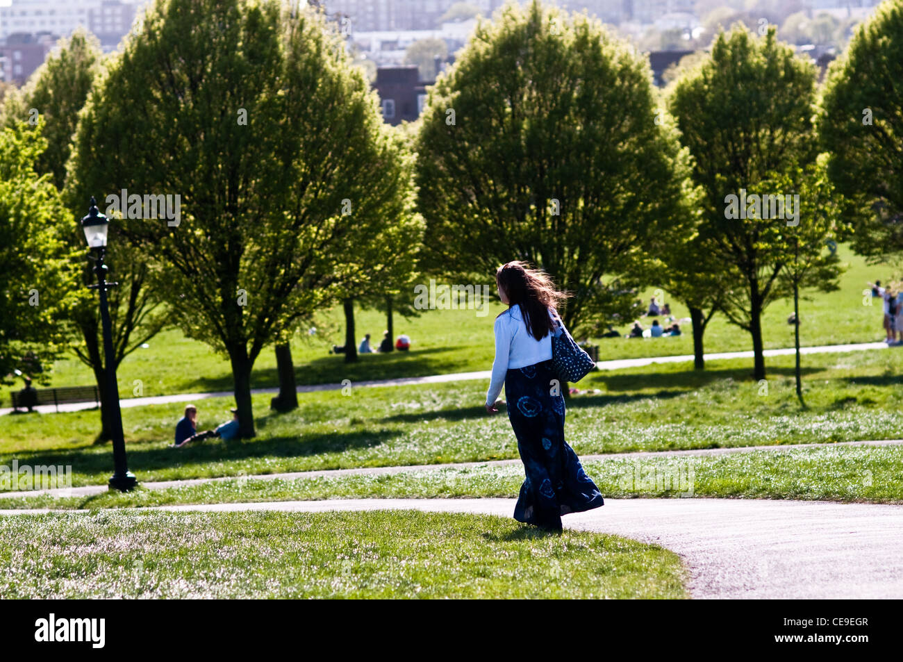 A woman walking down Primrose Hill, London, United Kingdom Stock Photo ...