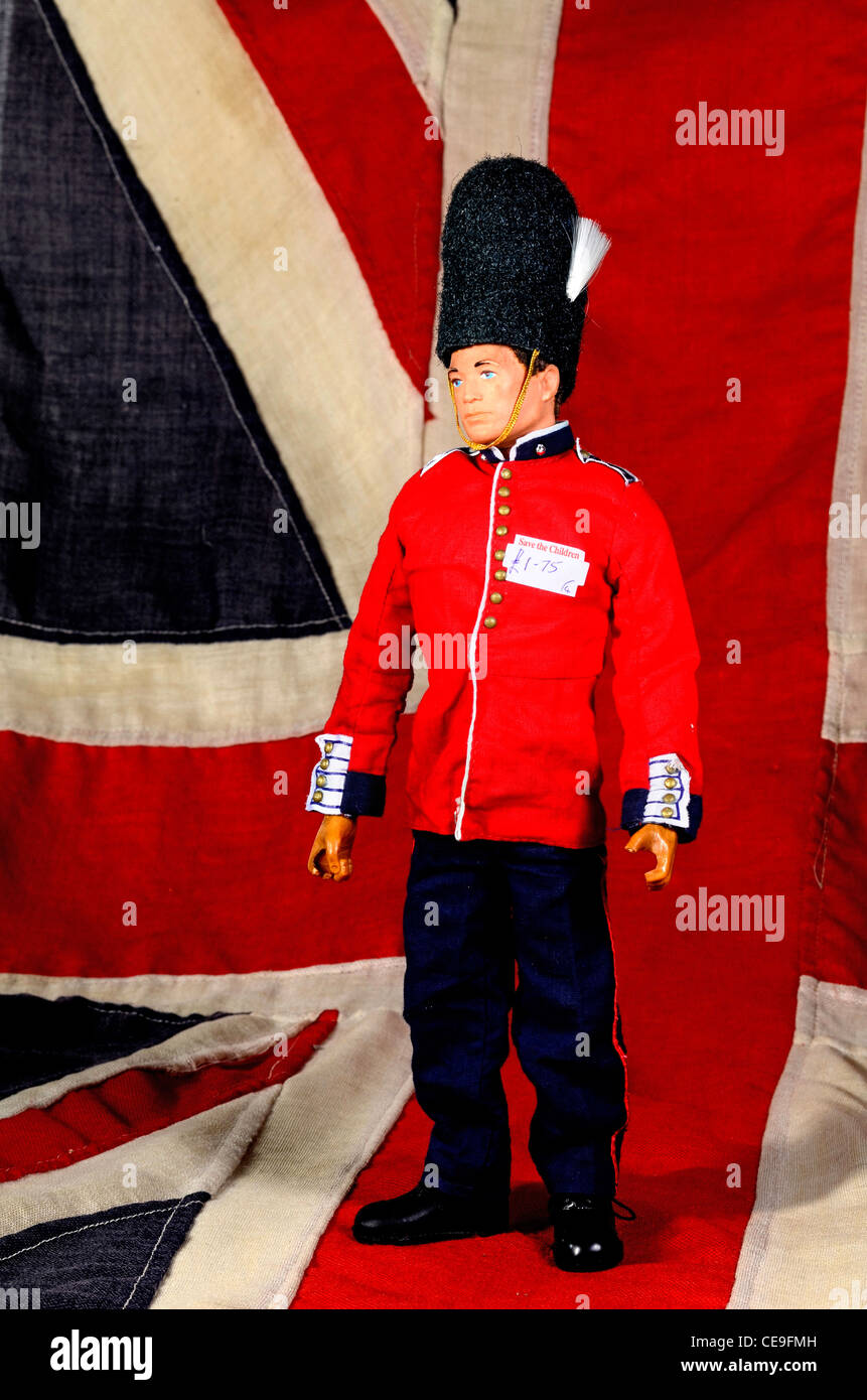Sad looking British guardsman doll with Union Jack flag Stock Photo - Alamy