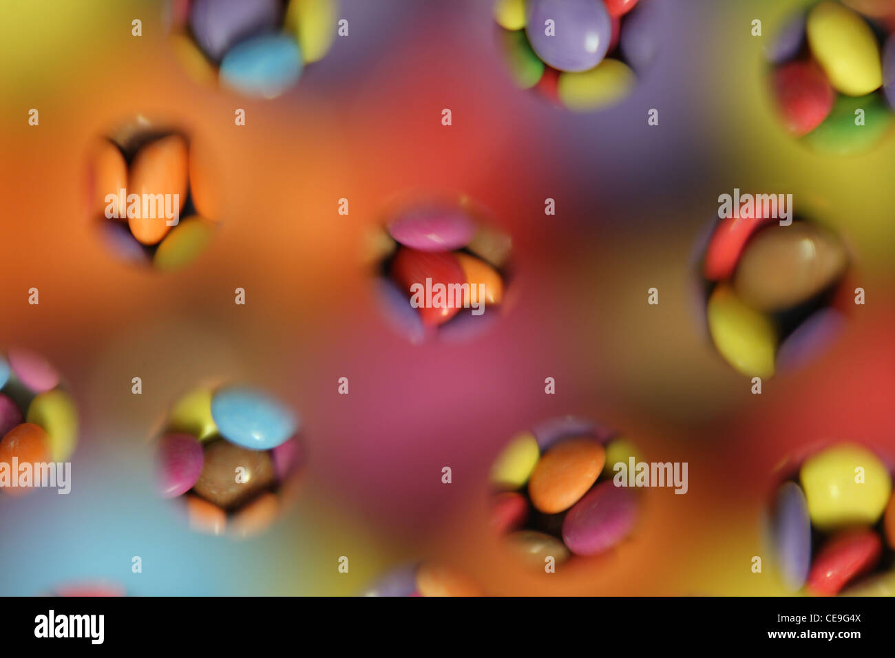 Coloured sweets through water droplets Stock Photo - Alamy