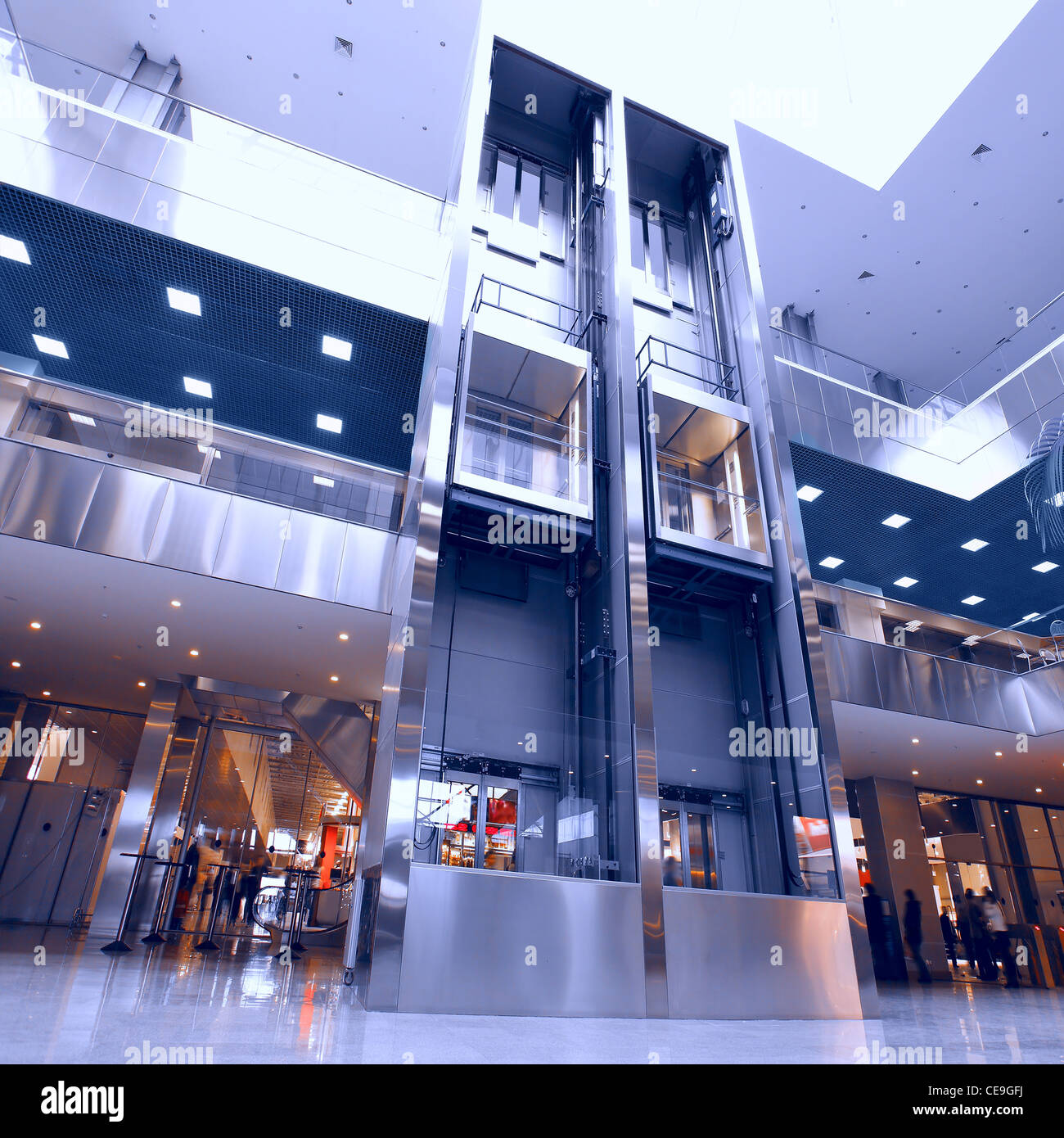 Modern interior of trade center with lifts Stock Photo - Alamy