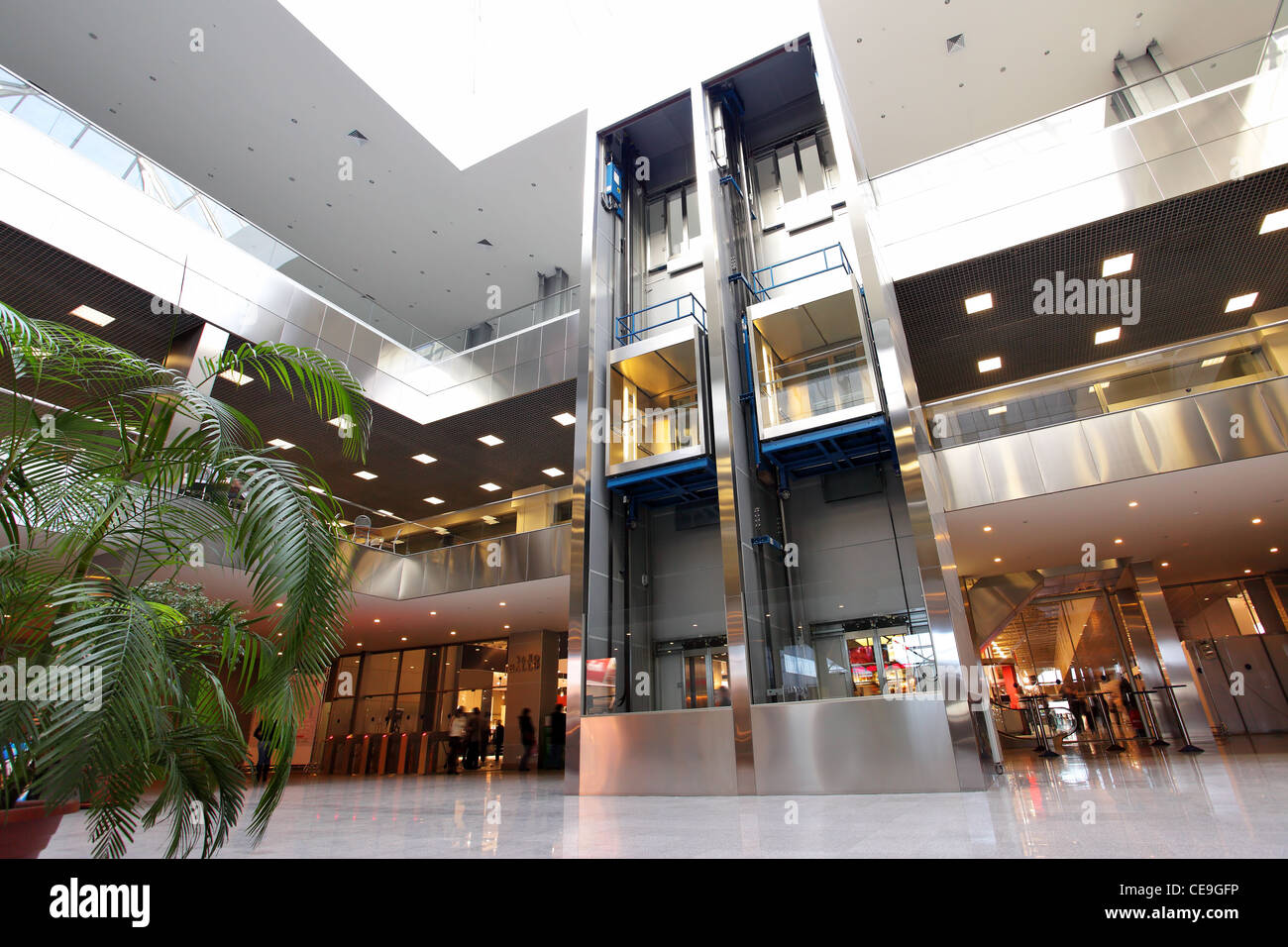 Modern interior of trade center with lifts Stock Photo - Alamy
