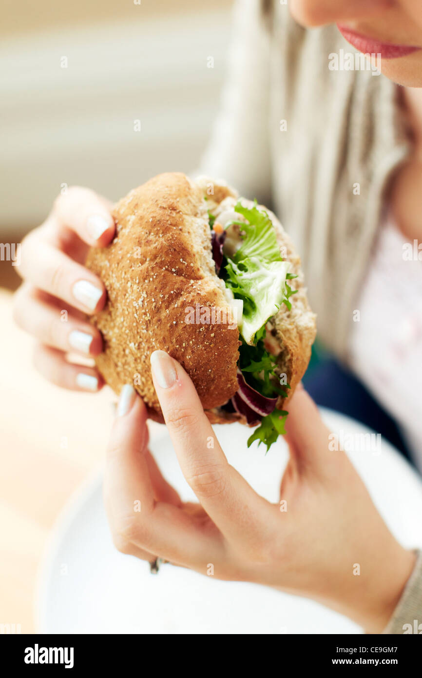 Girl eating healthy sandwich Stock Photo - Alamy
