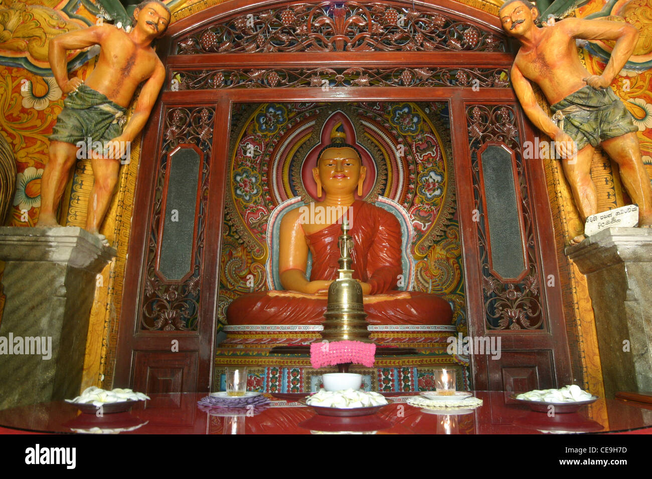 A Buddhist Shrine in a temple complete with offerings Stock Photo - Alamy