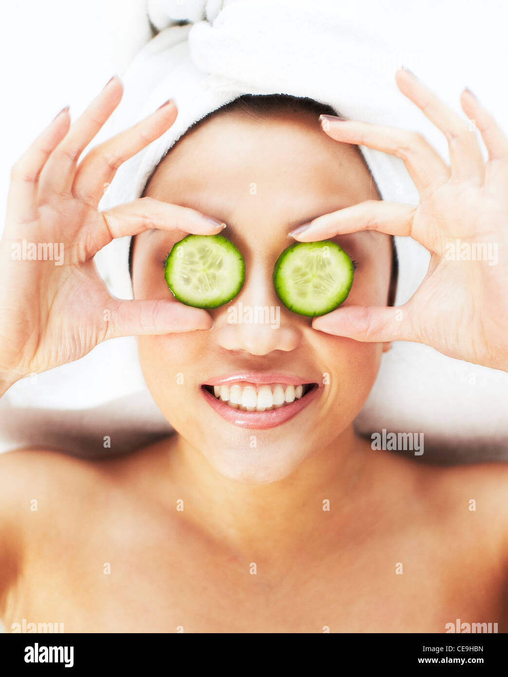 Woman with cucumber over her eyes Stock Photo - Alamy