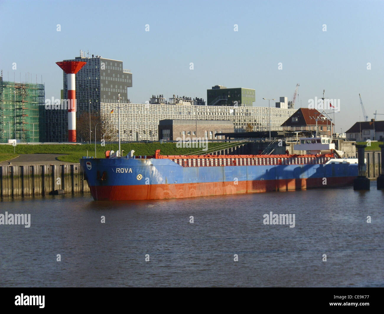 The general cargo ship Rova is docked at a port, engaged in loading or ...