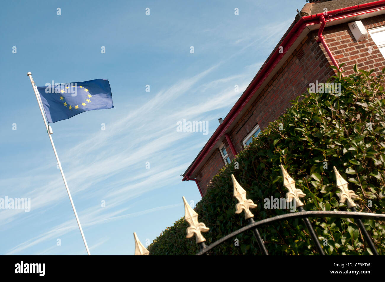European Union flag flying from a flagpole in a typical English Suburb ...